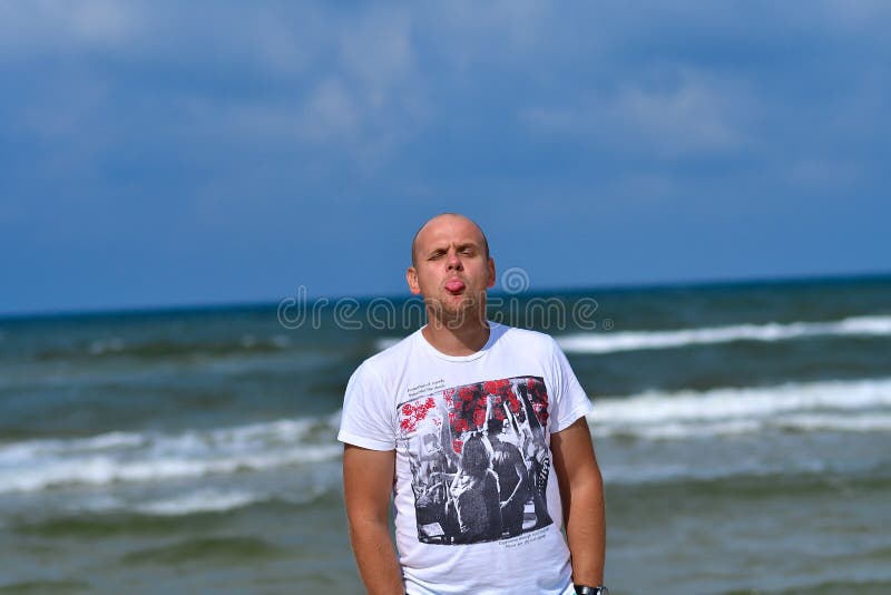 Relaxed Young Man Standing on the Beach Stock Image - Image of active ... Relaxed Young Man Standing on the Beach Stock Image - Image of active ...