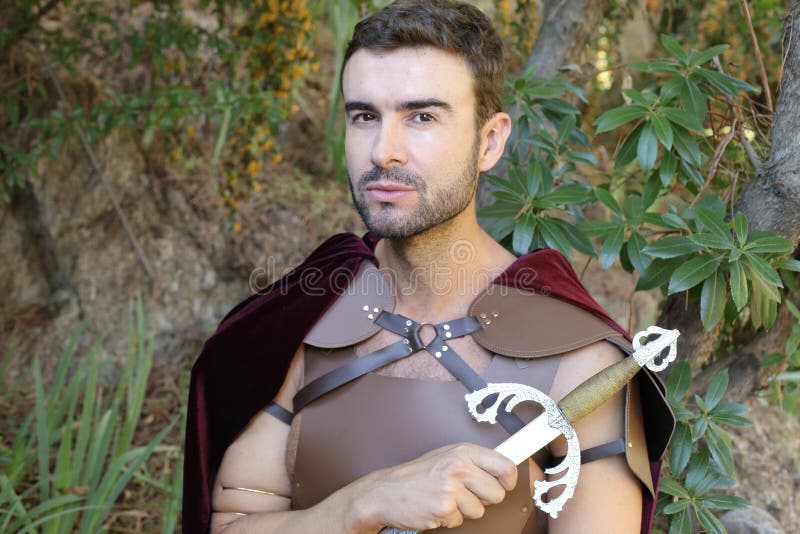 Handsome Roman Soldier Holding a Sword Stock Photo - Image of conquest ...