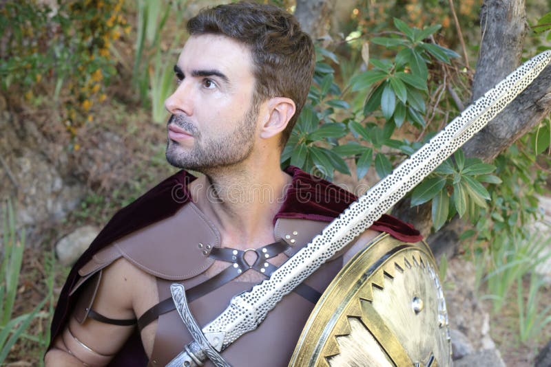Handsome Roman Soldier Holding a Sword Stock Photo - Image of greek ...