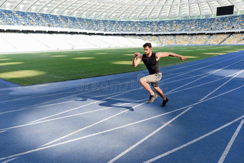Runner Exercising on Running Track at Stock Photo - Image of sunshine ...
