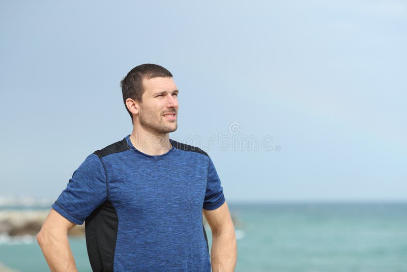 Runner Looking Away on the Beach Stock Photo - Image of copyspace ...