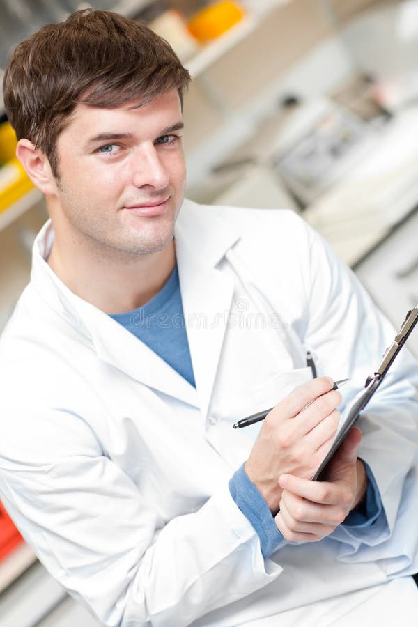 Handsome Scientist Holding a Clipboard and Smiling Stock Image - Image ...