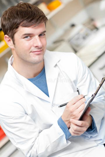 Handsome Scientist Holding a Clipboard and Smiling Stock Image - Image ...