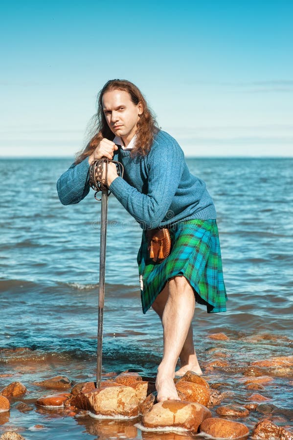 Handsome Scottish Man with Sword and Pipe Stock Photo - Image of forest ...