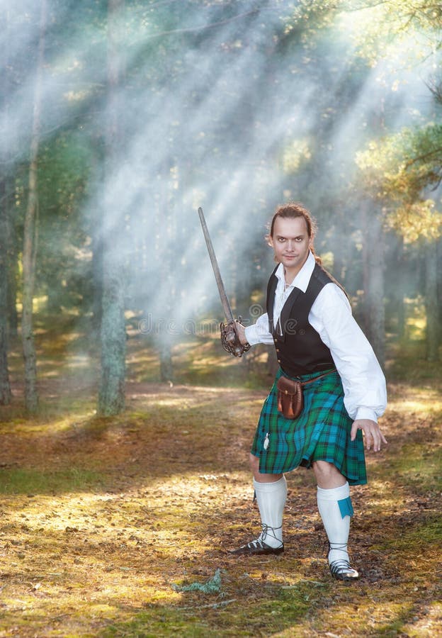 Handsome Scottish Man with Sword and Pipe Stock Image - Image of scot ...