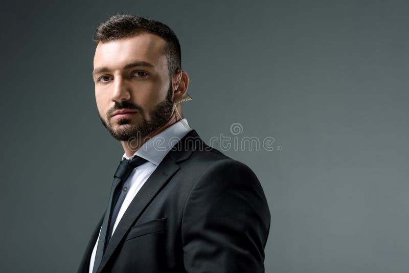 Handsome Security Guard with Security Earpiece Looking at Camera Stock ...
