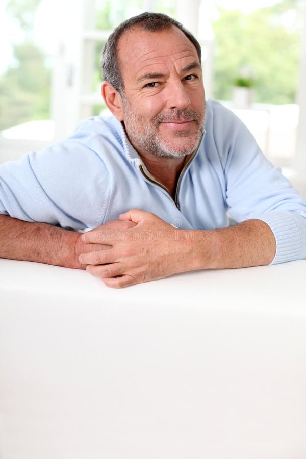Handsome Senior Man Smiling Leaning on Sofa Stock Photo - Image of aged ...