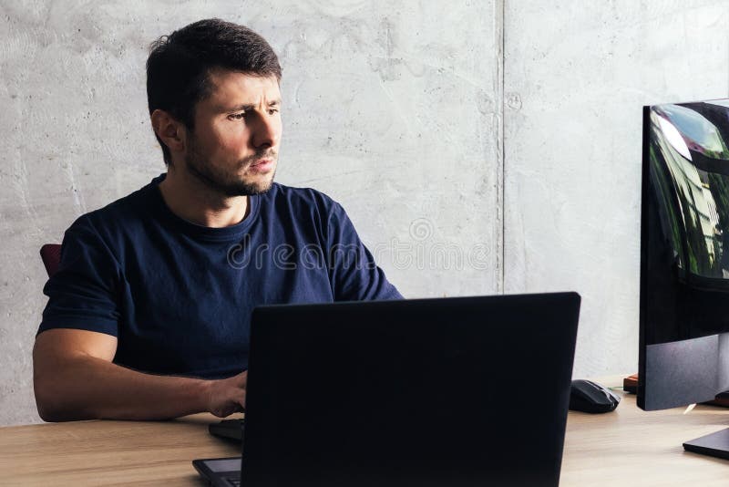 Man at the Office Desk, Working on Laptop Stock Photo - Image of ...