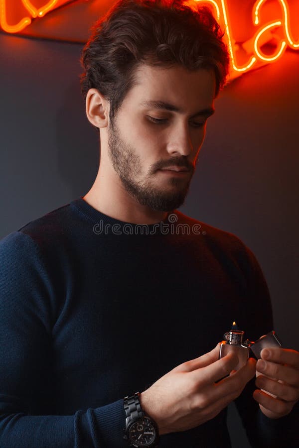 Handsome Serious Man Using a Lighter Stock Image - Image of attractive ...