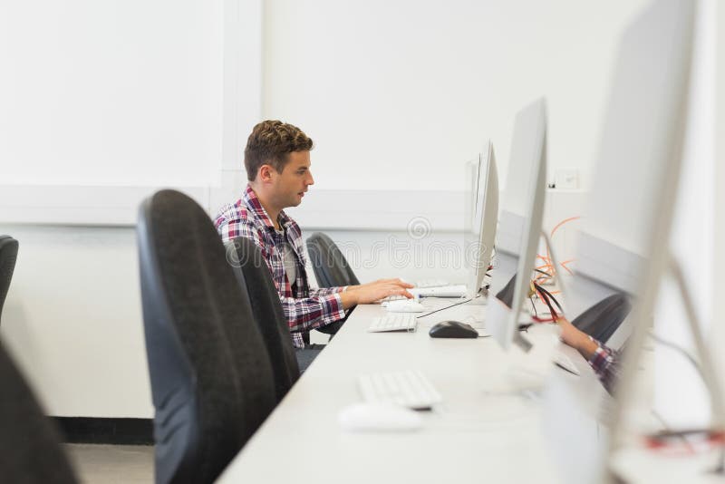 Handsome Serious Student Working on Computer Stock Photo - Image of ...
