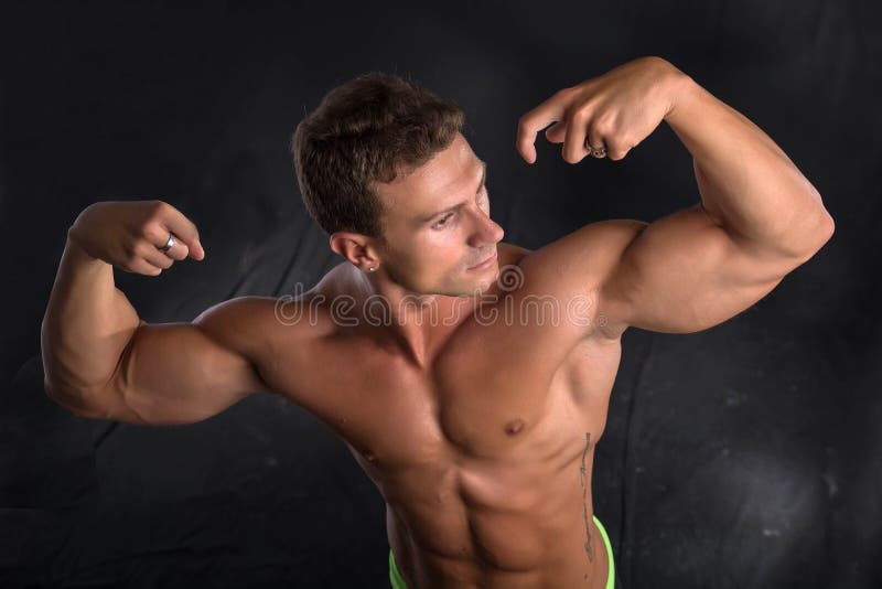 Low Angle Shot of Shirtless Male Bodybuilder on Stock Image - Image of ...
