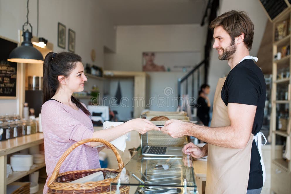 Handsome Shop Assistant Serving Customer in Package-free Store Using ...
