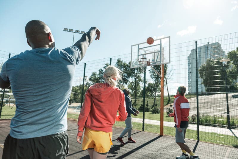 Handsome Skilled Man Throwing a Ball from the Distance Stock Photo ...