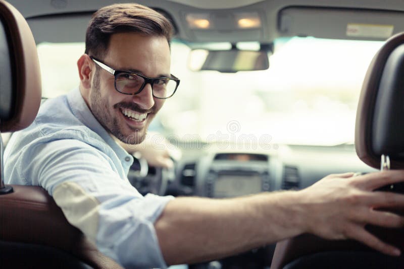Handsome Businessman Driving a Car To Work Stock Photo - Image of ...