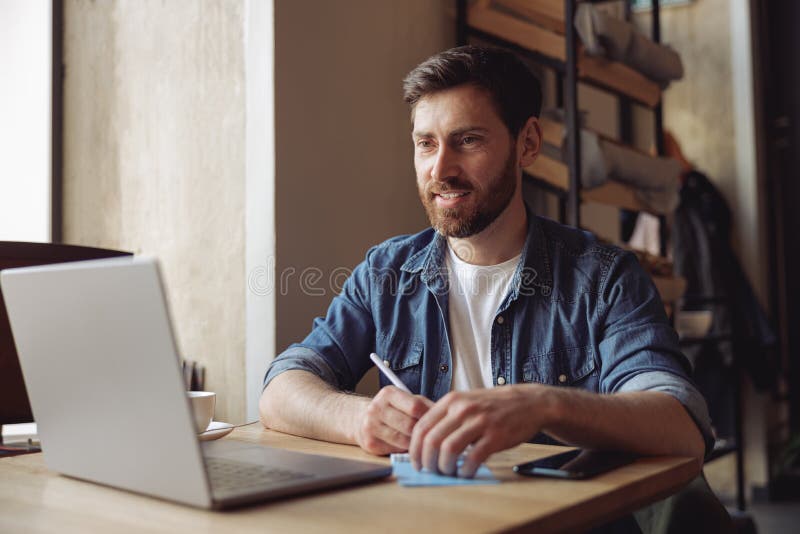 Handsome Smiled Man Taking Notes in Notebook and Working in Cafe at ...