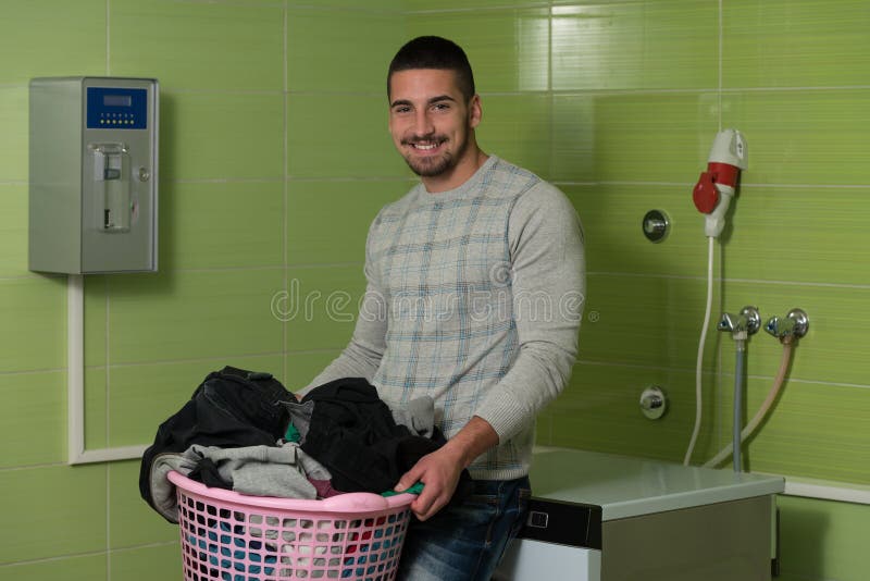 Handsome Smiling Man in the Laundry Room Stock Photo - Image of husband ...