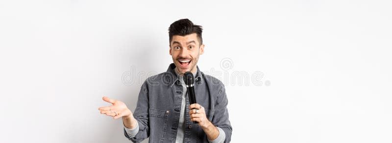 Handsome Smiling Performer Talking in Mic, Gesturing and Performing ...