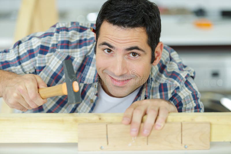Handsome Smiling Workman Using Hammer Stock Image - Image of people ...