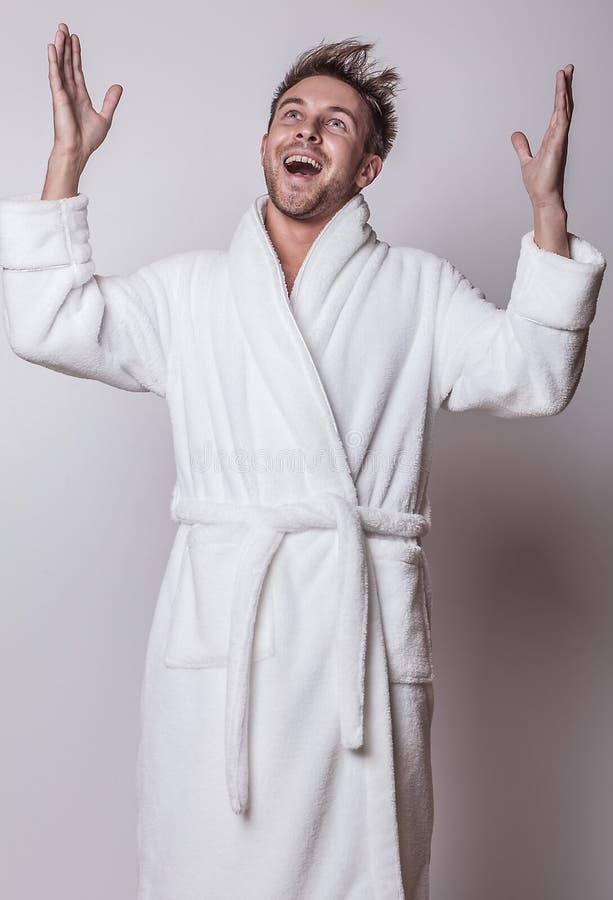 Handsome Smiling Young Man in Luxurious Bathrobe. Stock Photo - Image ...