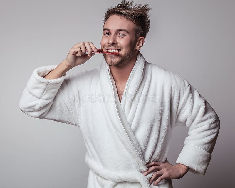 Handsome Smiling Young Man in Luxurious Bathrobe. Stock Photo - Image ...
