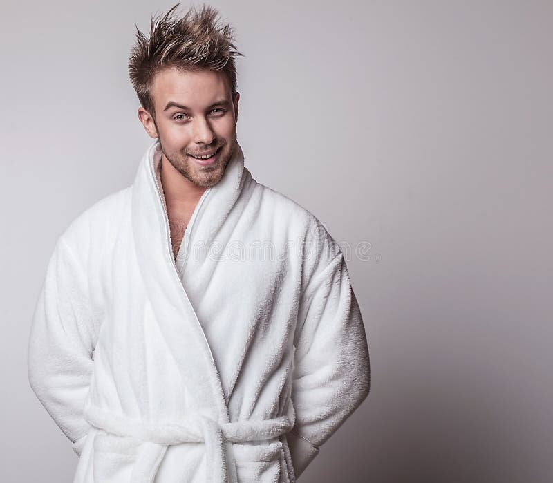 Handsome Smiling Young Man in Luxurious Bathrobe. Stock Photo - Image ...