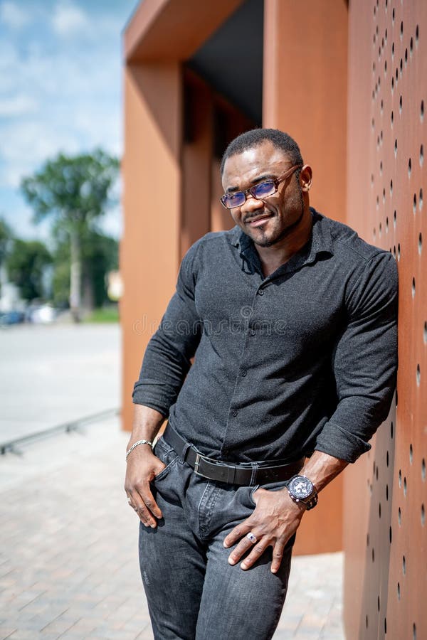 Handsome Sportive Guy Standing at the Building, Leaning on the Wall ...