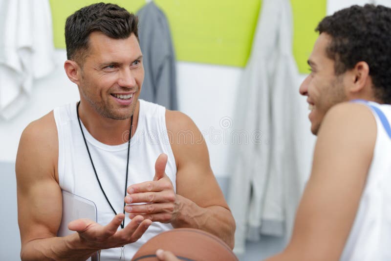 Handsome Sportmen Talking in Locker Room at Gym Stock Image - Image of ...