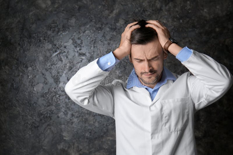 Handsome Stressed Doctor on Dark Background Stock Image - Image of male ...