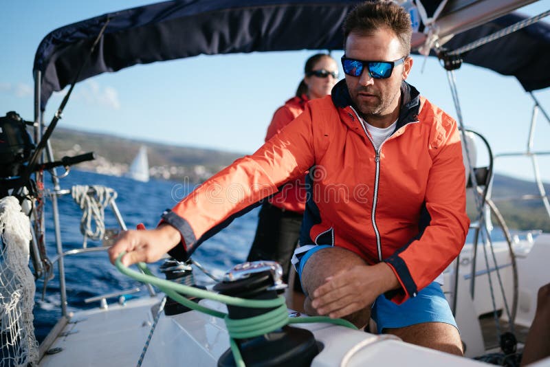 Handsome Strong Man Sailing with His Friends Stock Image - Image of ...