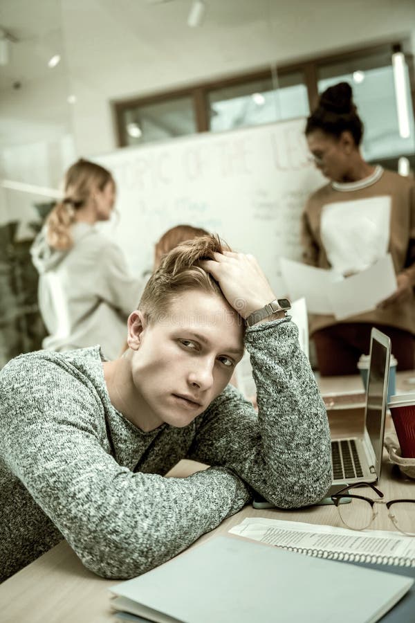 Handsome Postgraduate Student Feeling Unmotivated while Studying Stock ...