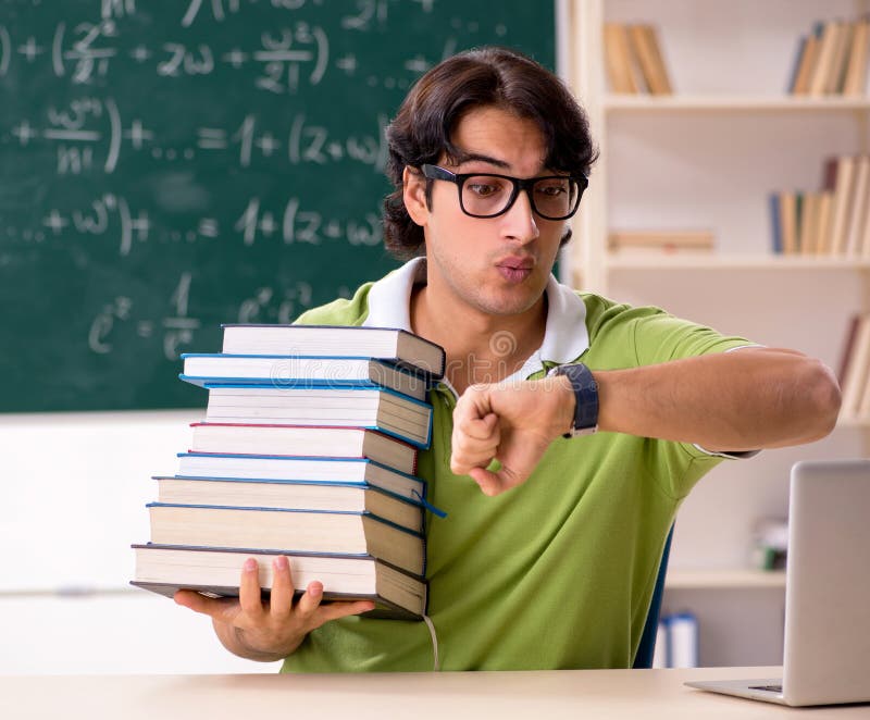 Handsome Student in Front of Chalkboard with Formulas Stock Photo ...