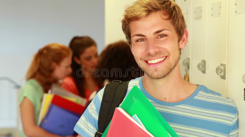 Handsome Student Leaning on Locker Smiling at Camera Stock Footage ...