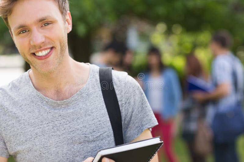 Handsome Student Smiling at Camera Outside on Campus Stock Photo ...