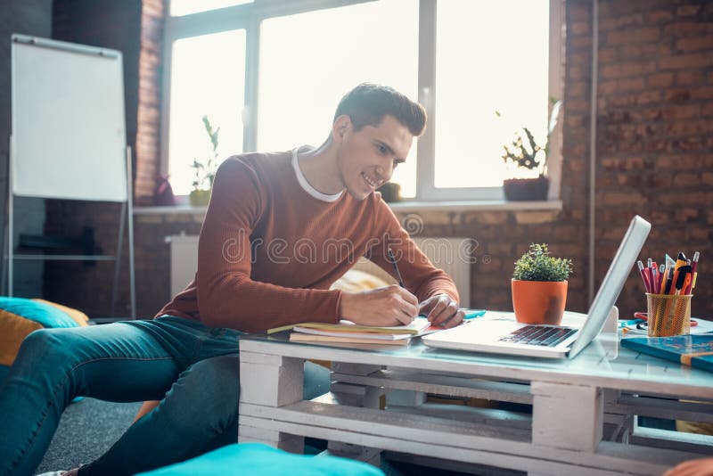 Handsome Student Smiling while Enjoying Studying Process at Home Stock ...