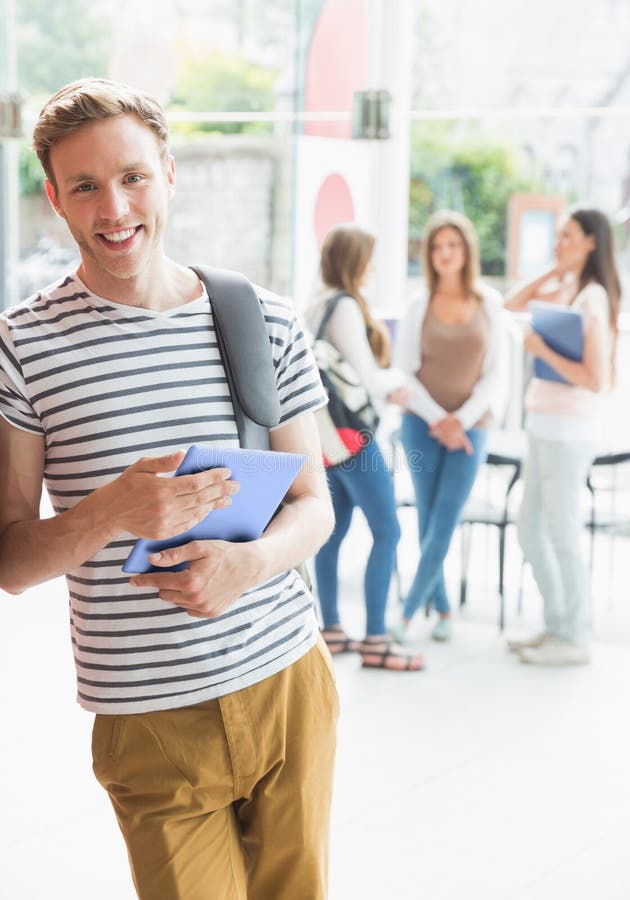 Handsome Student Smiling and Holding Tablet Stock Photo - Image of ...