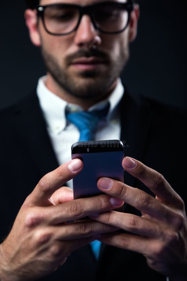 Handsome Stylish Man in Elegant Black Suit Using Mobile Phone. Stock ...
