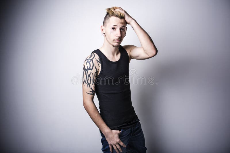 Handsome Stylish Young Man with Tattoo and Piercing Stock Image - Image ...