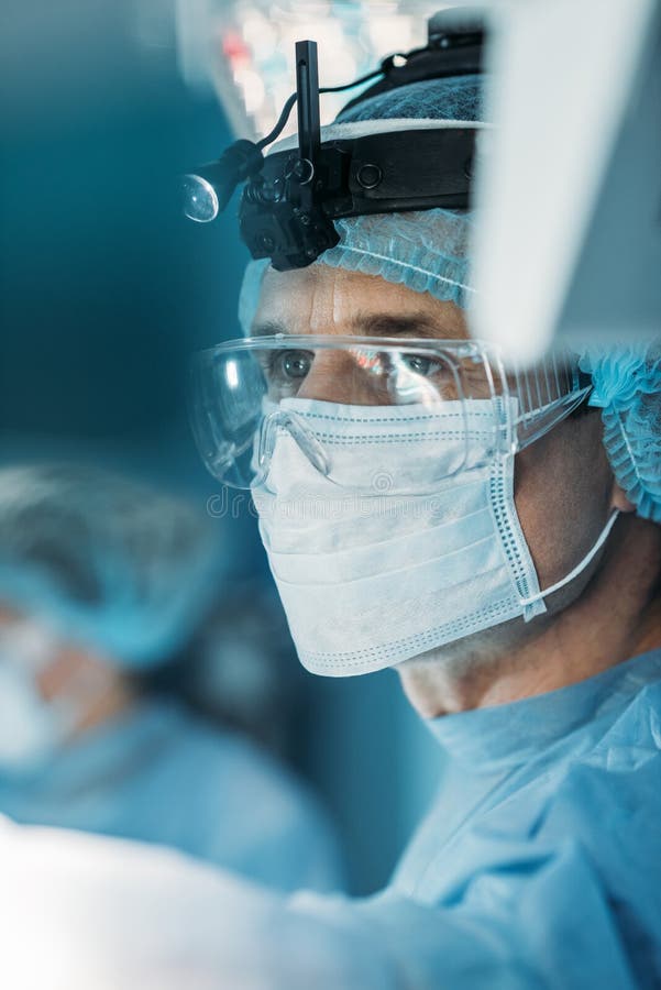 Handsome Surgeon in Medical Mask Stock Photo - Image of surgeons, away ...