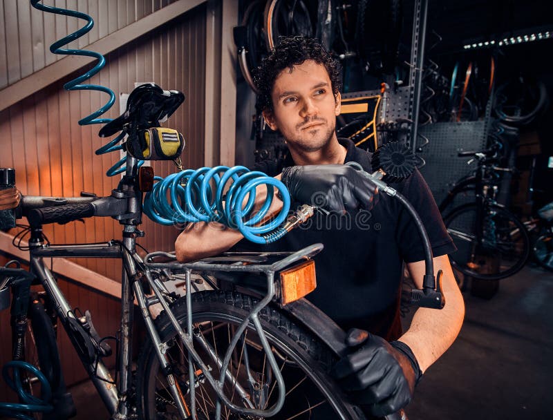 Handsome Talented Master is Fixing Bicycle at His Own Workshop Using ...