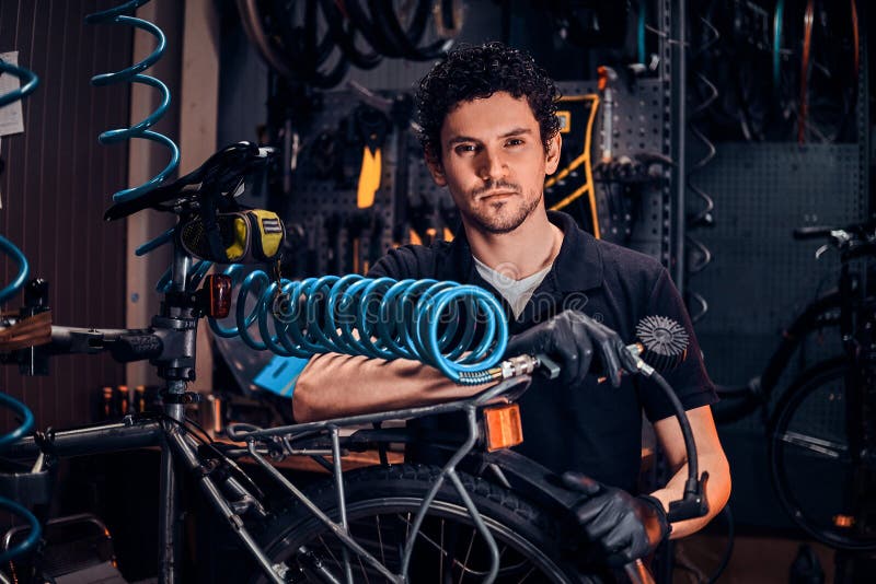 Handsome Talented Master is Fixing Bicycle at His Own Workshop Using ...