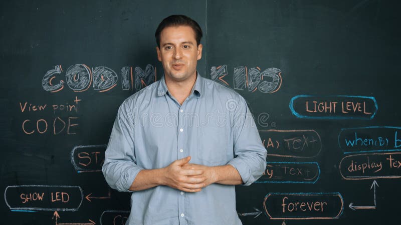 Handsome Teacher Teaching Engineering Code while Standing at Board. Edification. Stock Image ...