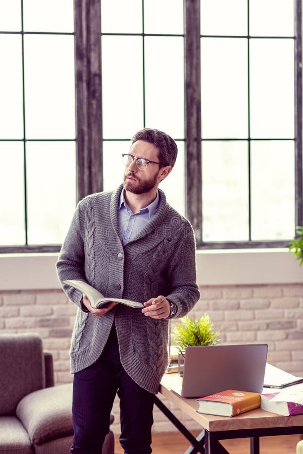 Handsome Thoughtful Man Standing with a Book Stock Photo - Image of ...