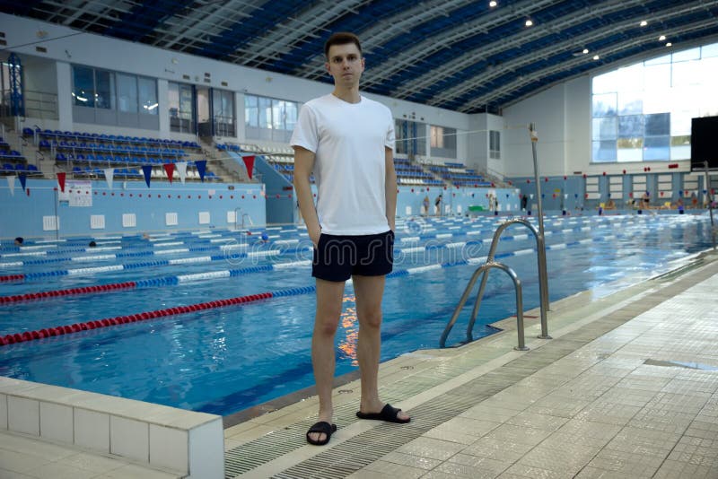 Handsome Trainer in White T-shirt Standing at the Swimming Pool Stock ...