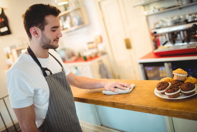 Handsome Waiter Cleaning Counter Stock Image - Image of retail, muffin ...