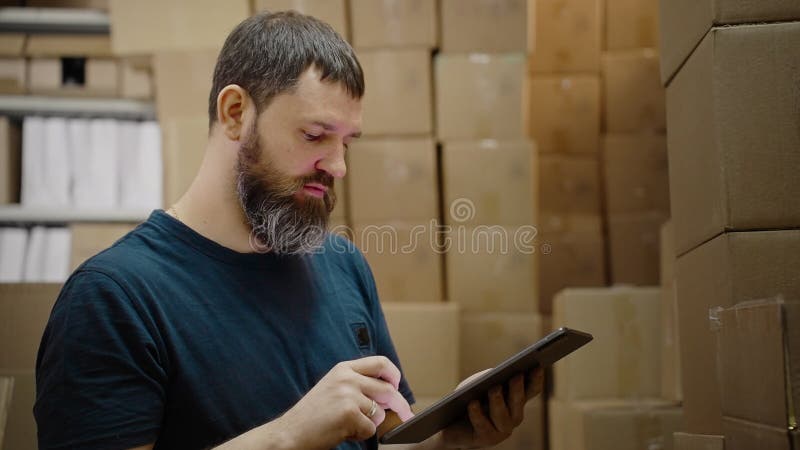 Handsome Warehouse Worker Uses Digital Tablet for Checking Stock Stock ...