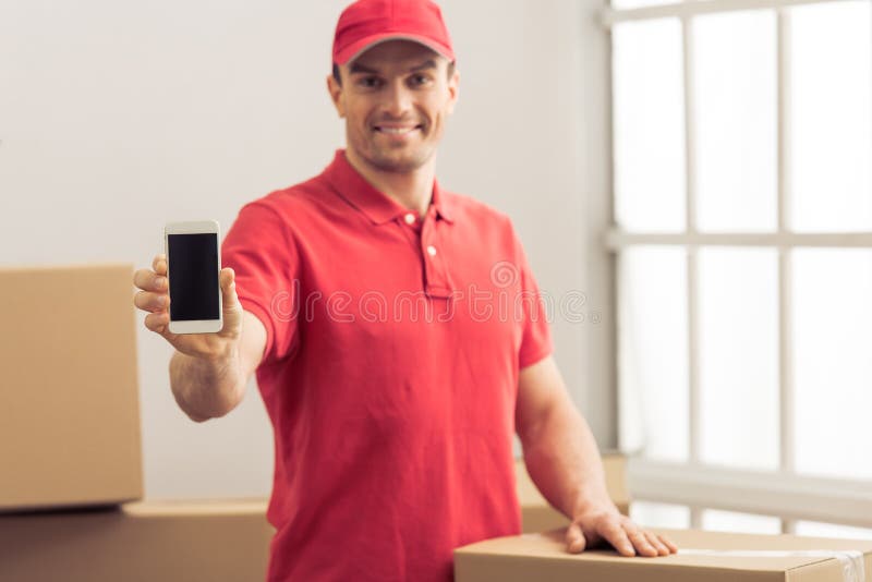 Handsome Worker Helping To Move Stock Image - Image of carton, male ...