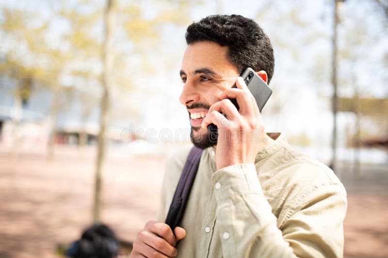 Handsome Young Arabic Man Walking Outside Talking Mobile Phone Stock ...