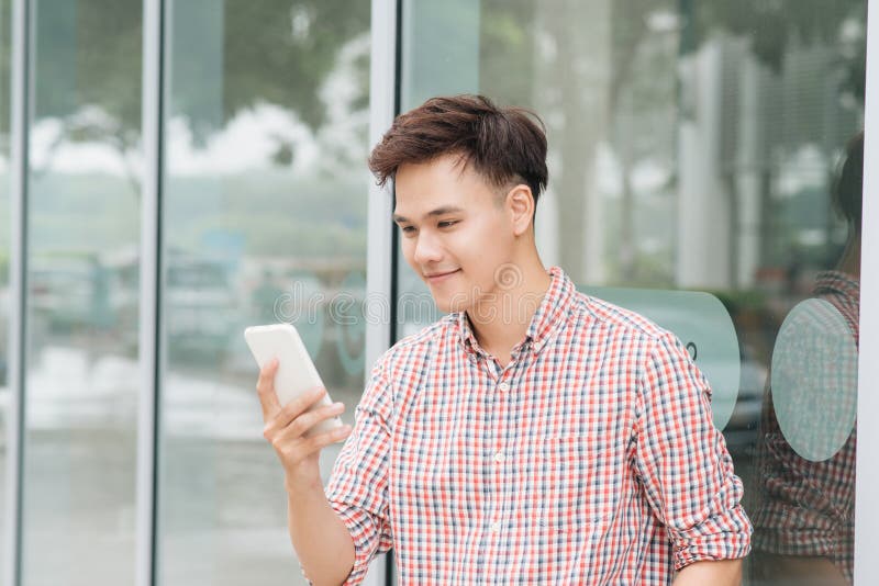 Handsome Young Asian Man Look at Cellphone Stock Image - Image of asian ...