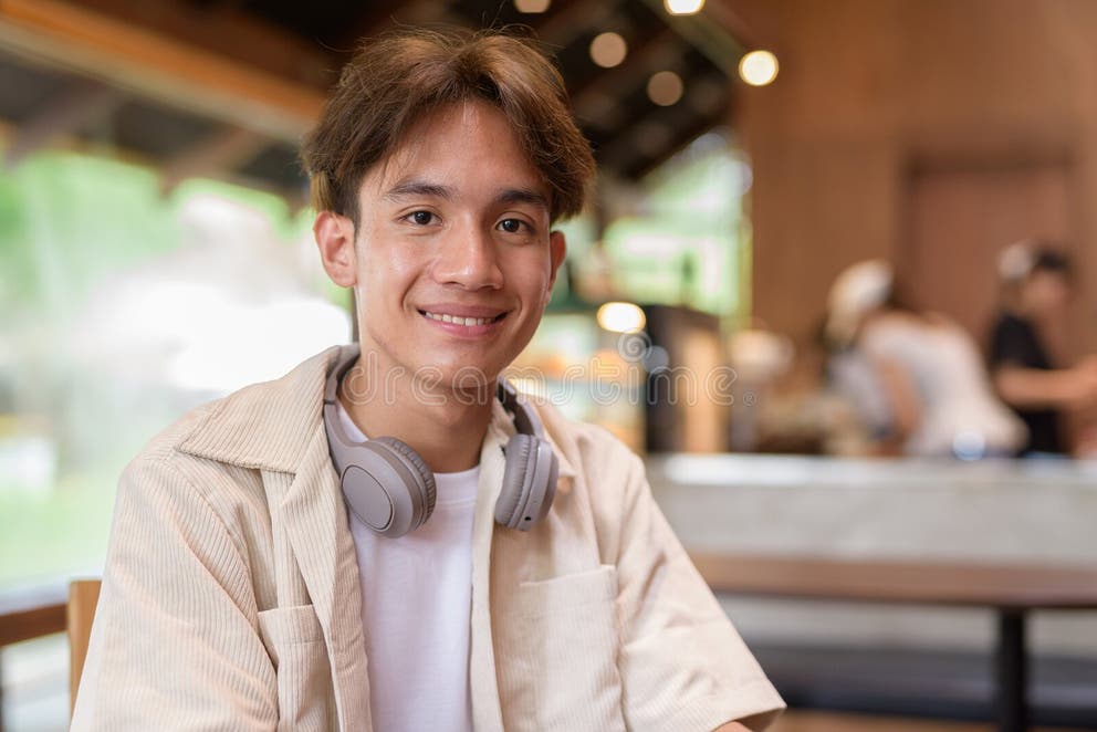 Handsome Young Non Binary Man Sitting in Cafe Restaurant Stock Image - Image of restaurant ...