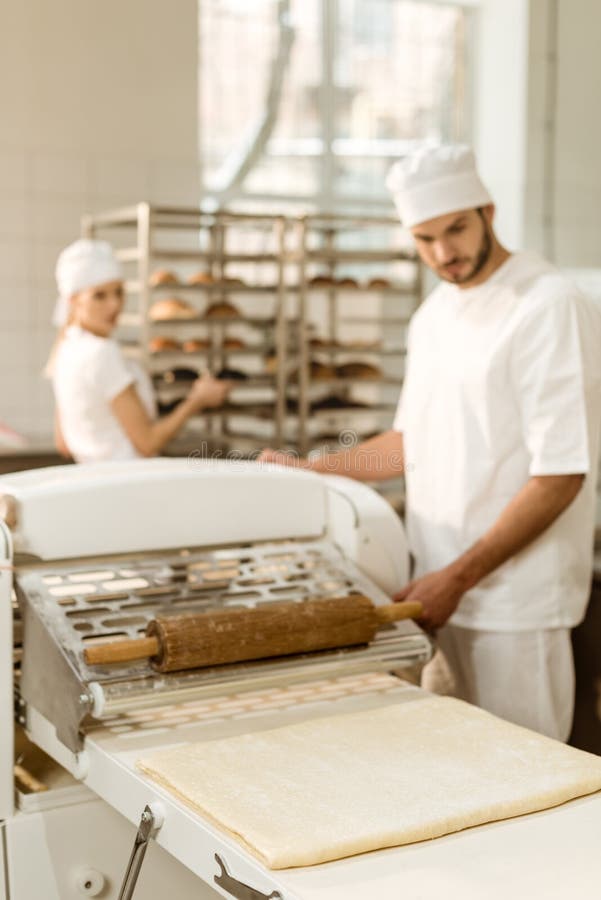 Handsome Young Baker Working with Industrial Dough Roller Stock Image ...